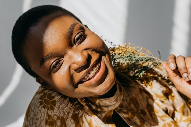 How to Smile Naturally for Pictures: 8 Tips & Tricks
